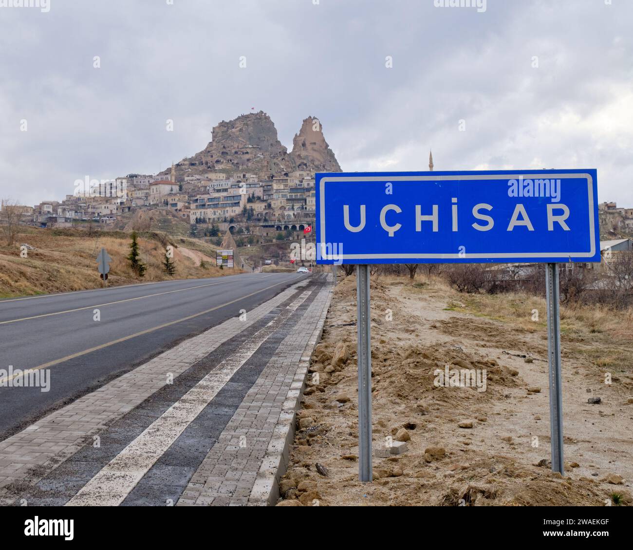 Road sign at the entrance of the village of Uchisar, Turkey Stock Photo ...