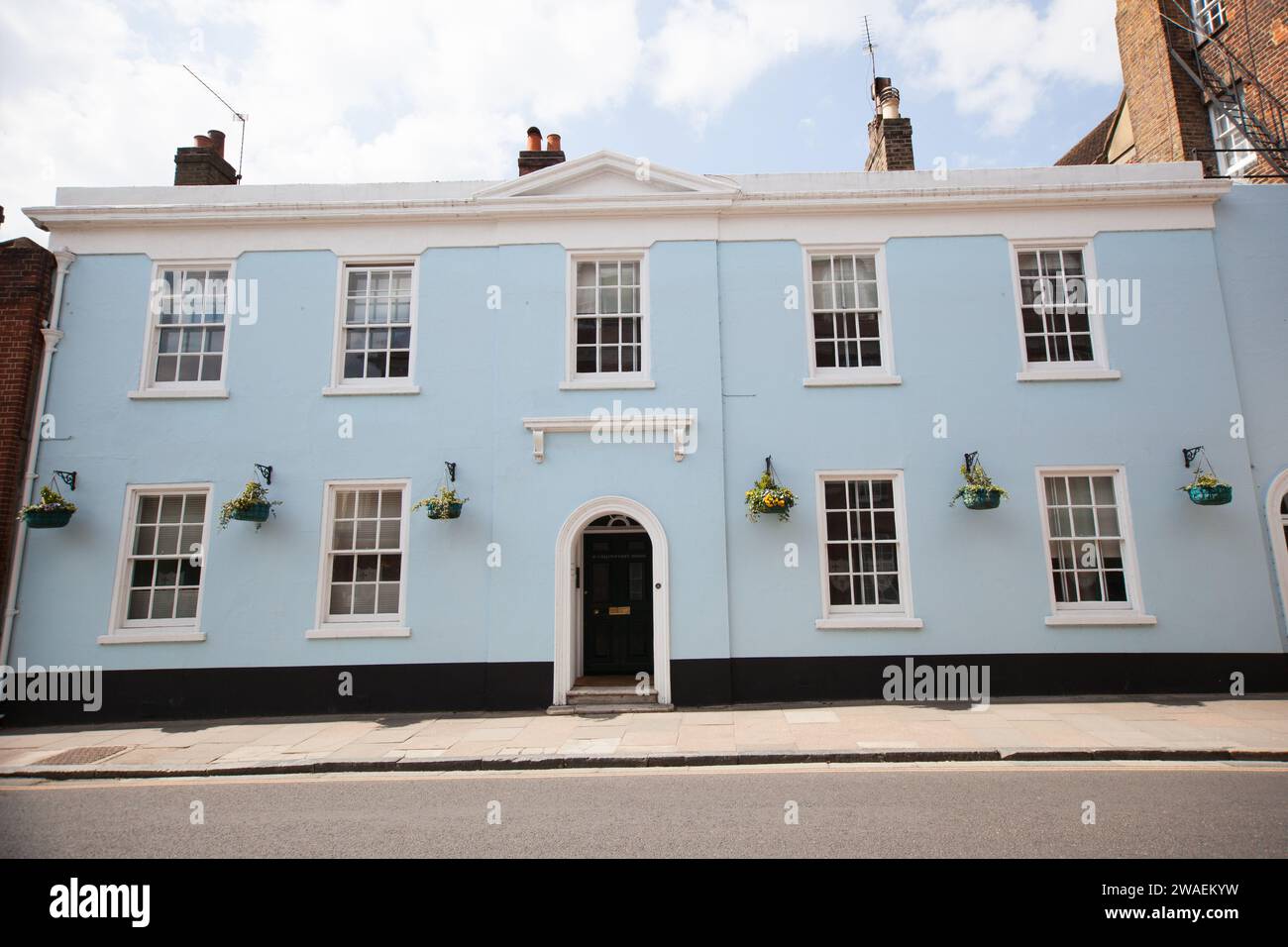 A large pale blue period building on the High Street of Eton, Windsor ...