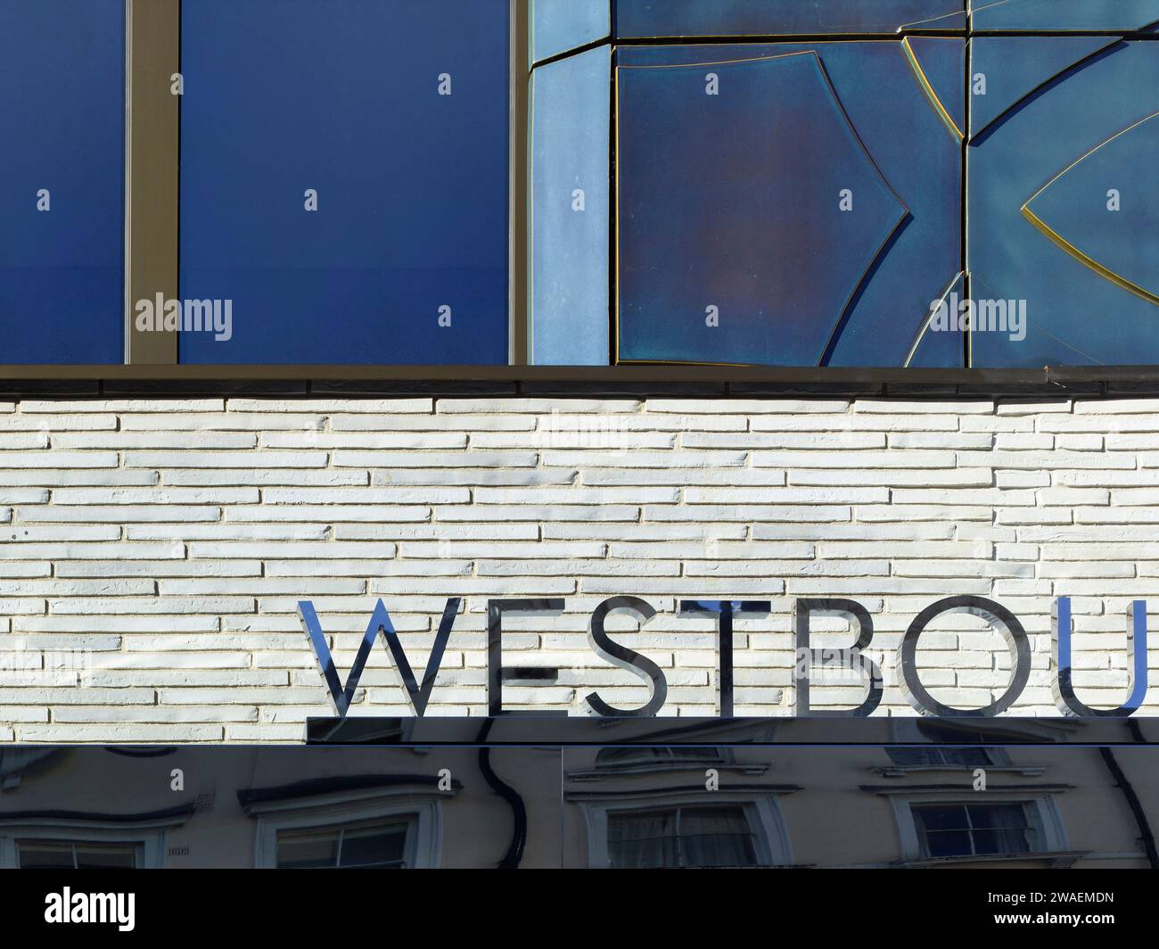 Facade detail with handmade brick and faience panel. Westbourne House ...