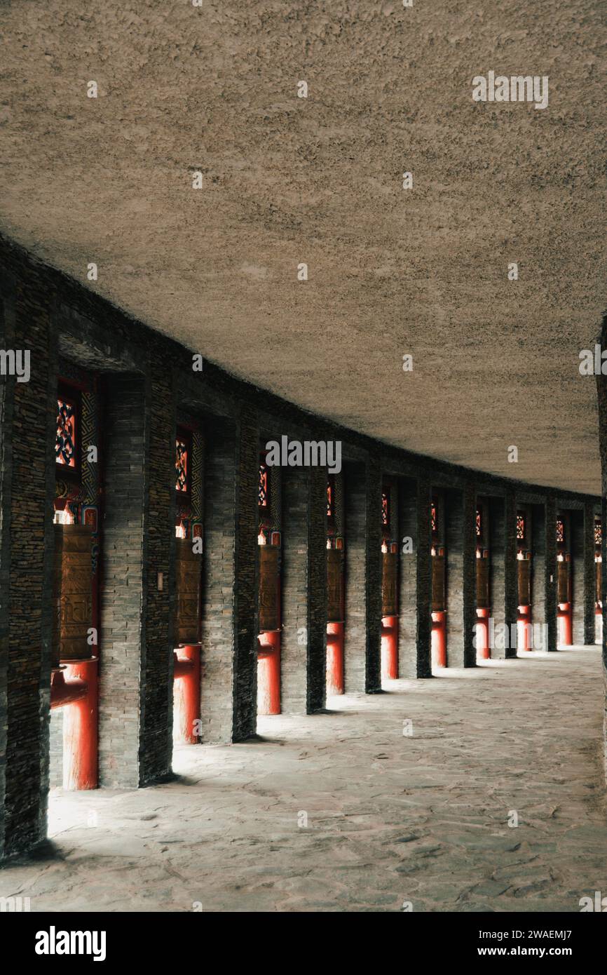 An outdoor corridor with walls of brick and glass Stock Photo - Alamy