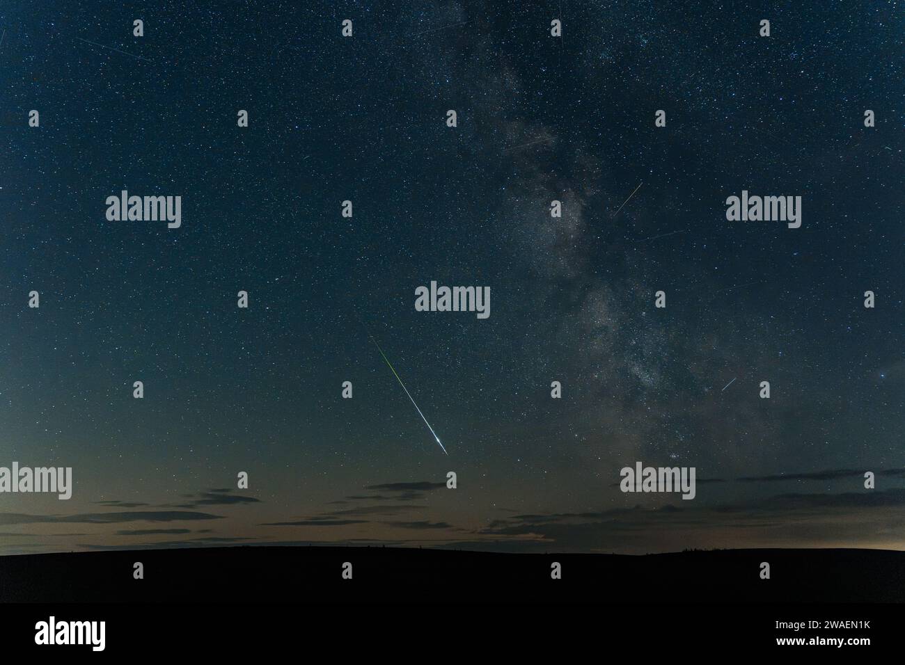 A Perseid Meteor across the night sky alongside the Milky Way core from ...