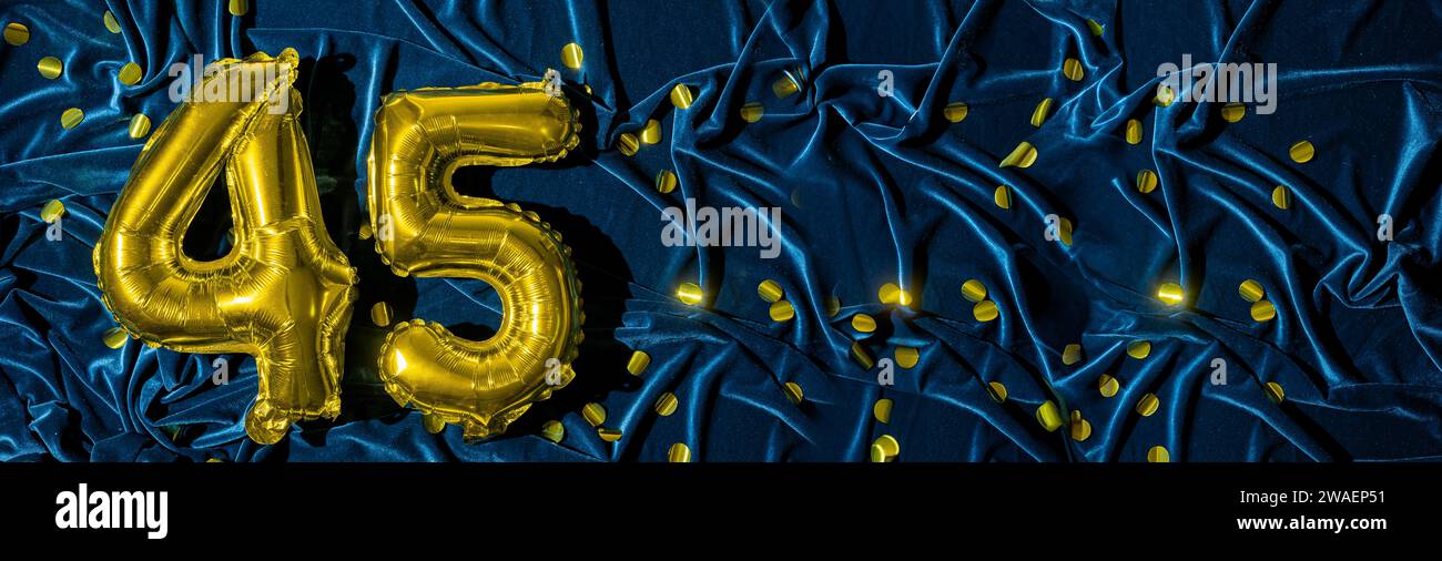 number forty five, gold foil balloon number on a blue velvet background ... number forty five, gold foil balloon number on a blue velvet background ...