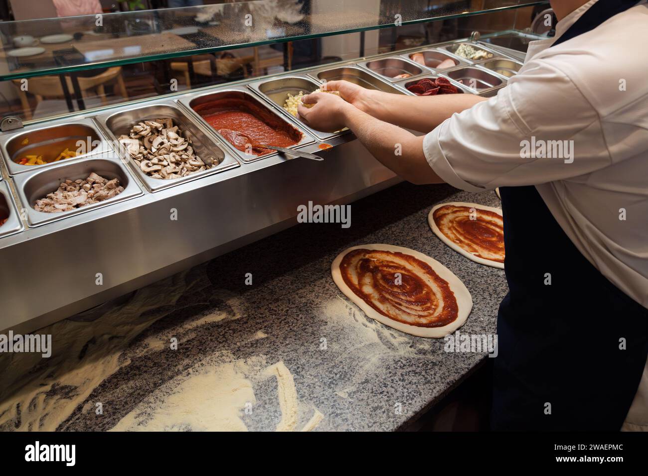 Pizza assembly hi-res stock photography and images - Alamy