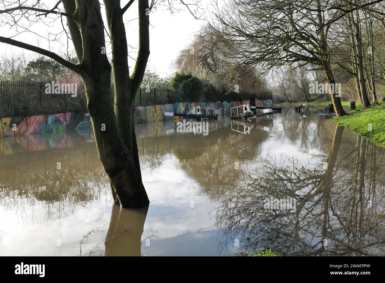 Reflections of a flooded landscape at the locks on the Grand Union ...