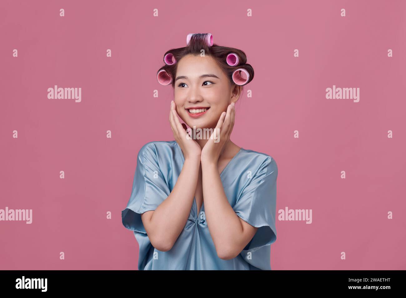Hairdressing Happy Woman Applying Hair Rollers On Beautiful Healthy