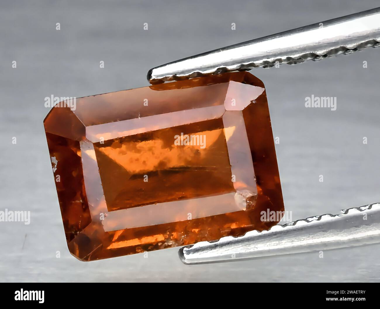 natural orange hessonite garnet gem on background Stock Photo - Alamy