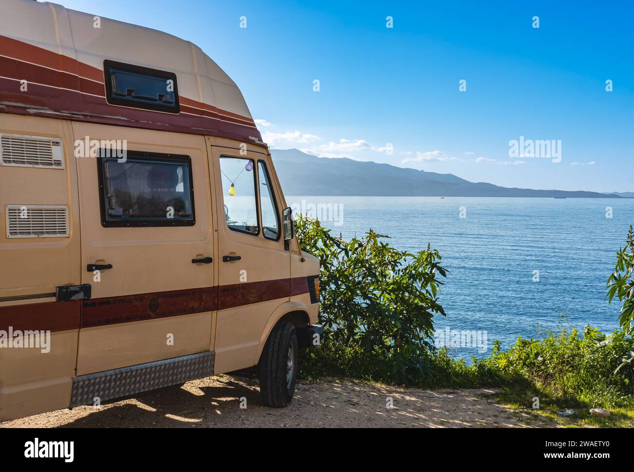 Motor homes, camper vans at sunset beach. Travel adventure vacation ...