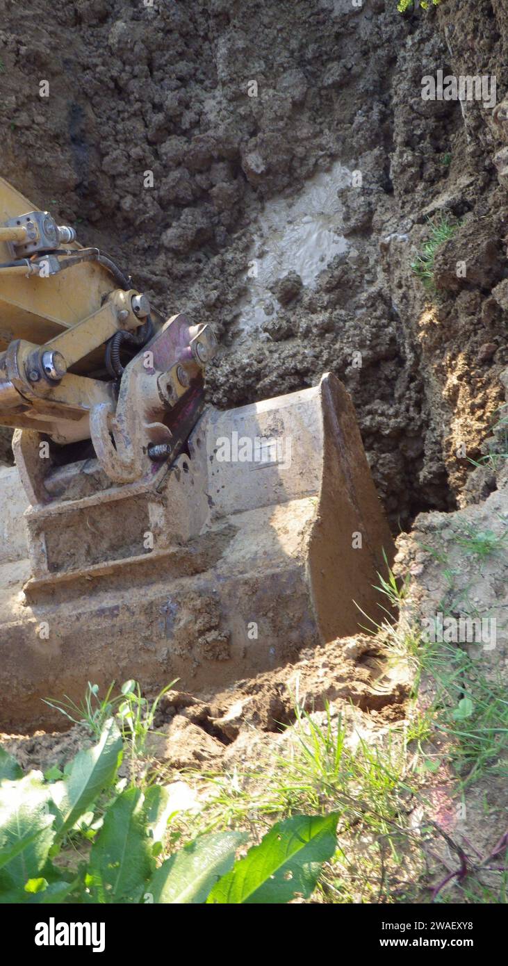 earthworks with an excavator in civil engineering on a construction ...