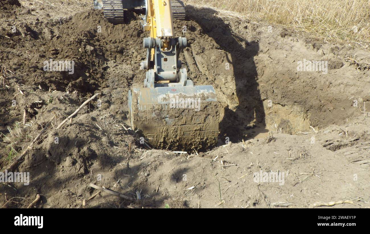 earthworks with an excavator in civil engineering on a construction ...