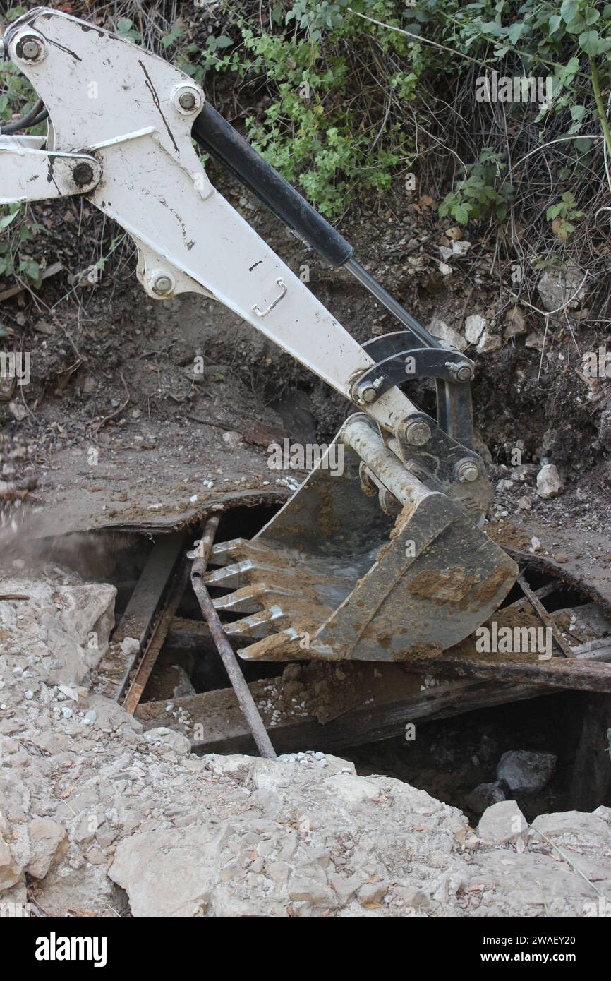 earthworks with an excavator in civil engineering on a construction ...