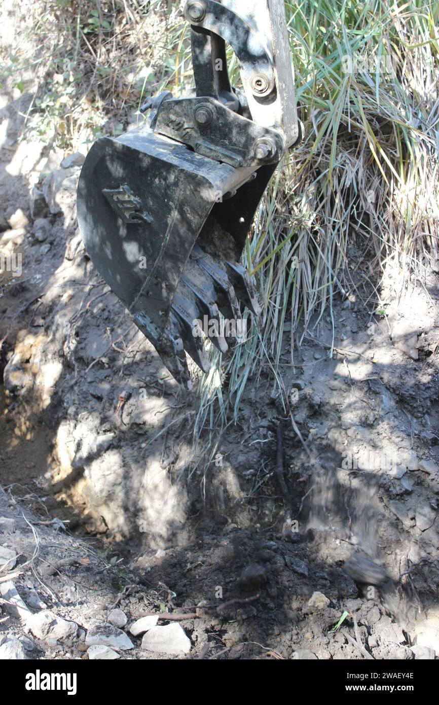 earthworks with an excavator in civil engineering on a construction ...