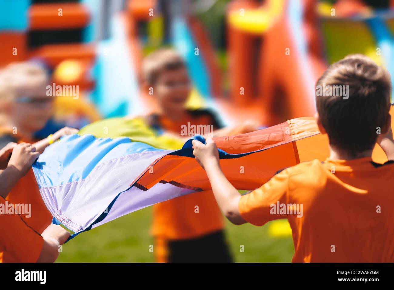 Group children play parachute game hi-res stock photography and images ...