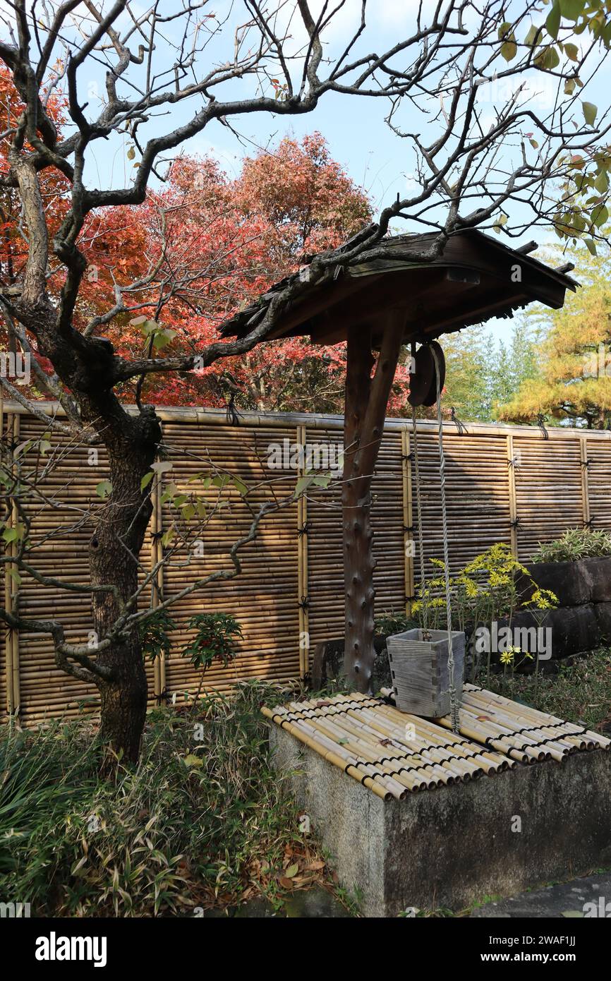 Autumn leaves and old well in the Garden of Bamboo in Koko-en Garden ...
