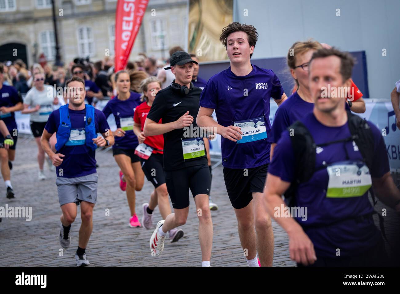 File Photo - Prince Christian crosses the finish line after 10 km run ...