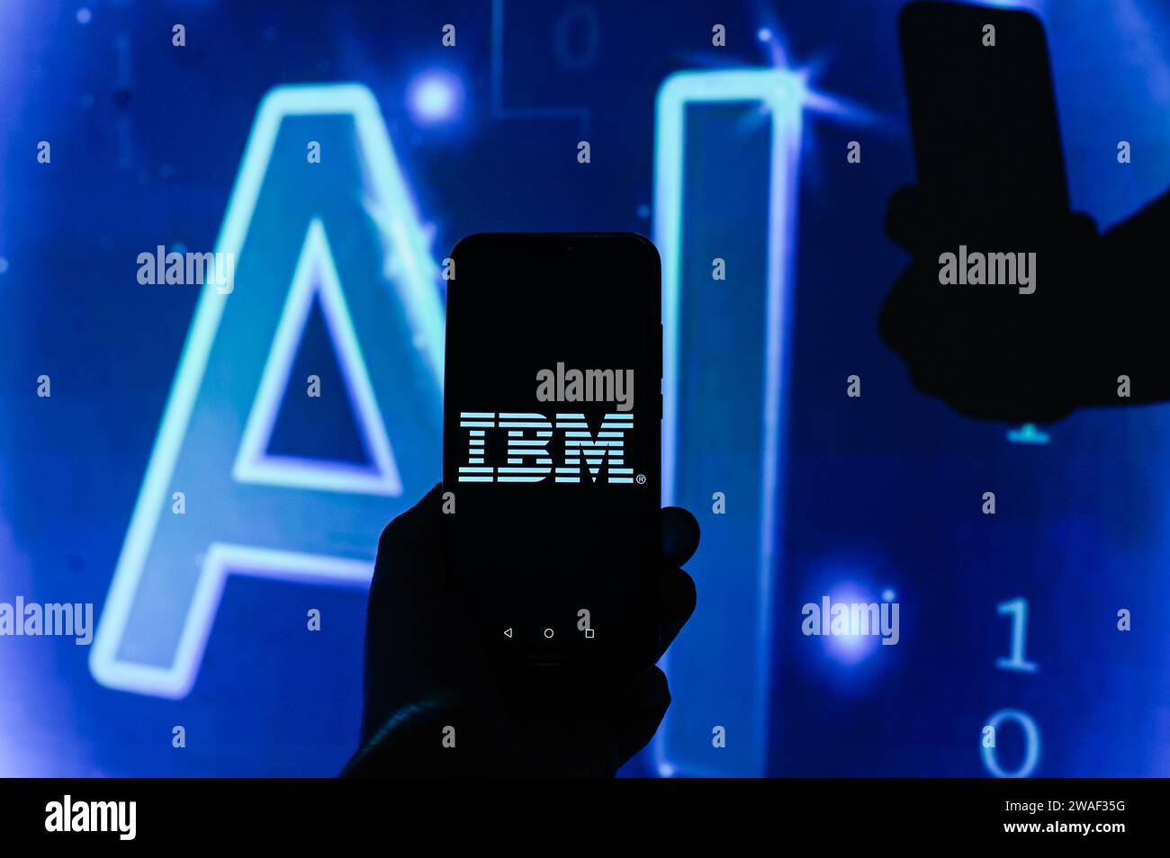In this photo illustration a IBM logo is displayed on a smartphone with ...