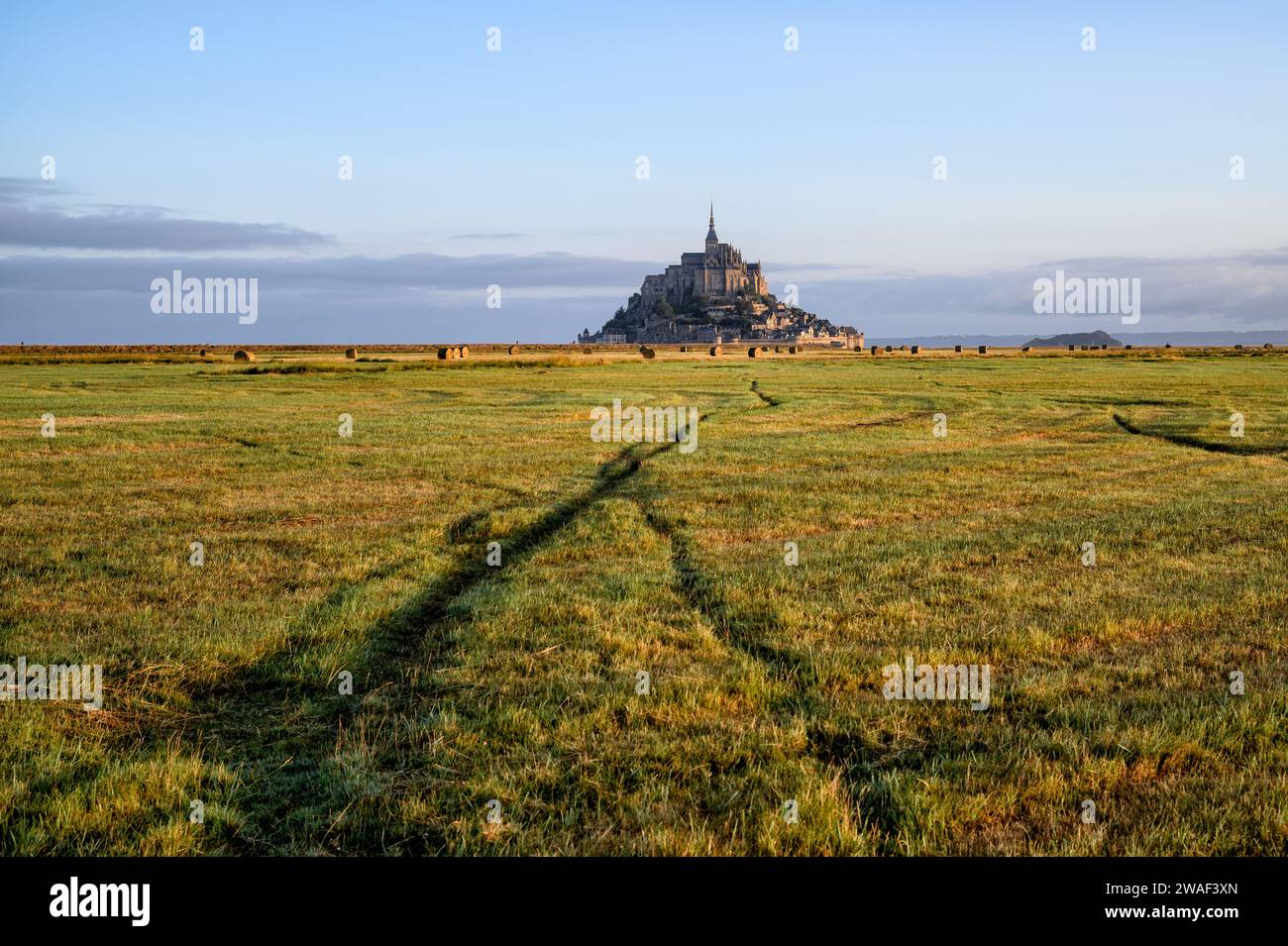 Landscape of Mont Saint-Michel castle and abbey in the early morning ...