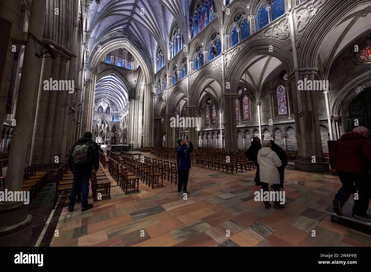 People walk and take pictures from one of the main altars of the ...