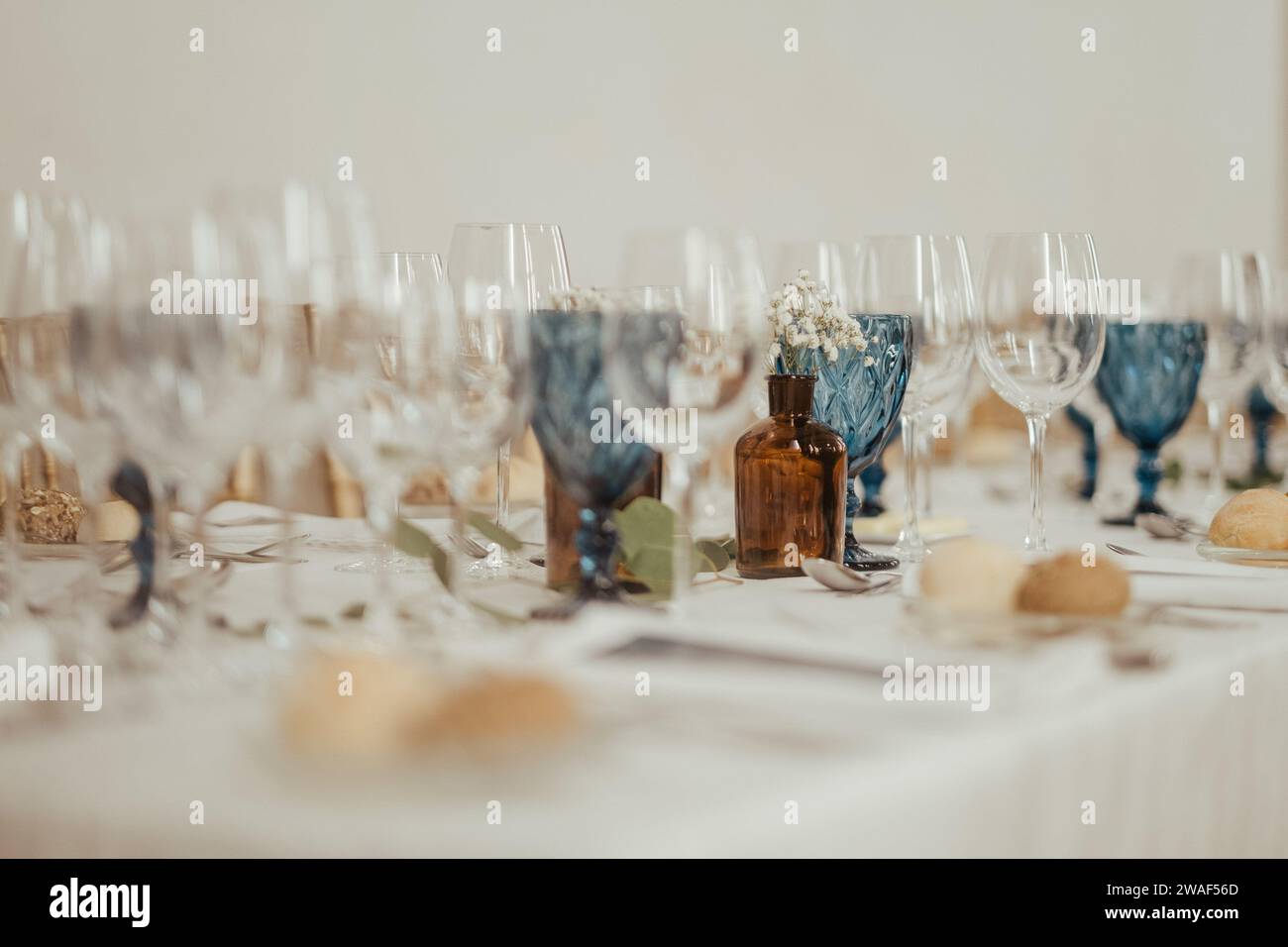 A formal dining table set up with white plates and silverware Stock ...