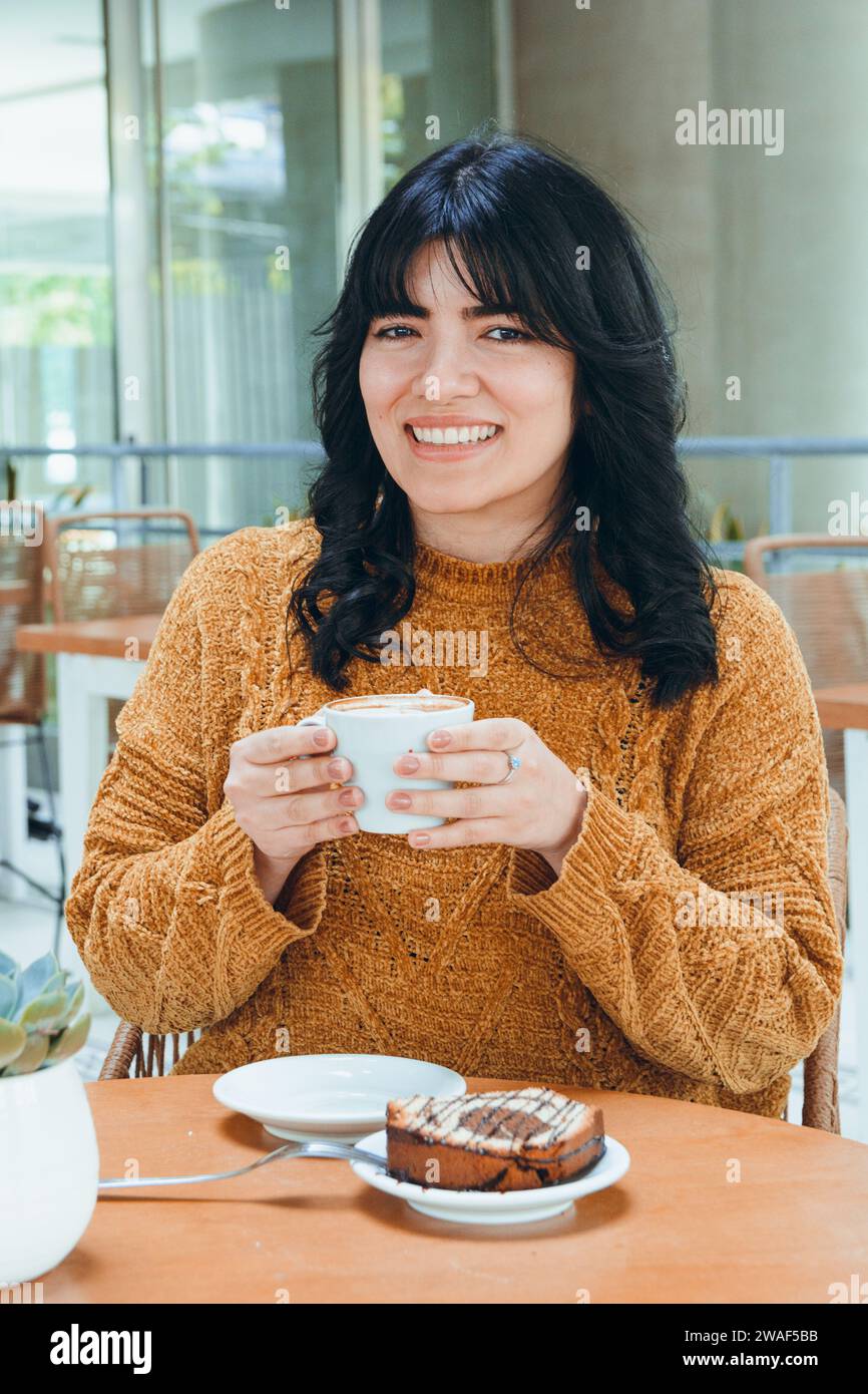 Portrait of young Latin Venezuelan woman, with curly black hair and ...