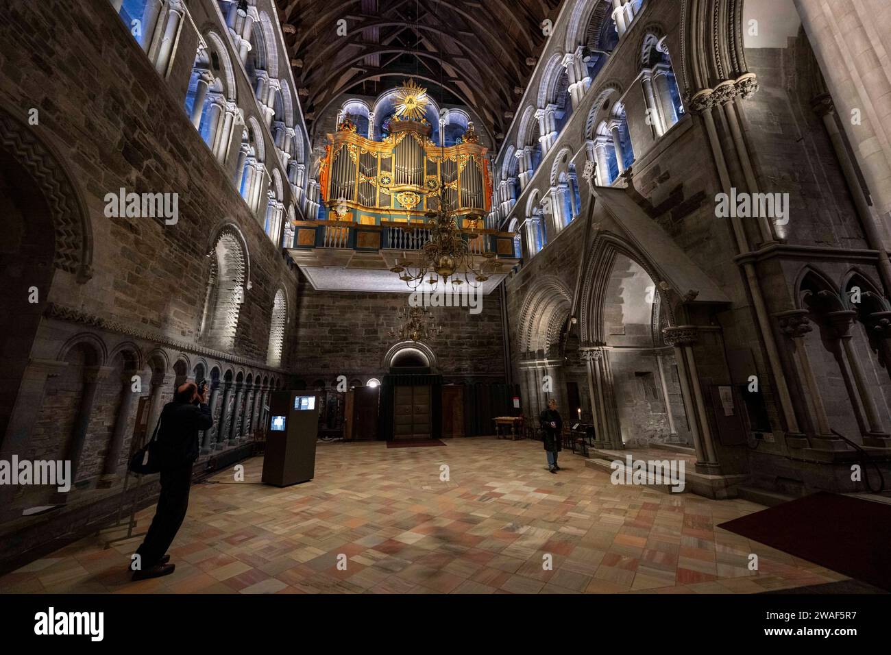People walk and take pictures from one of the main altars of the ...