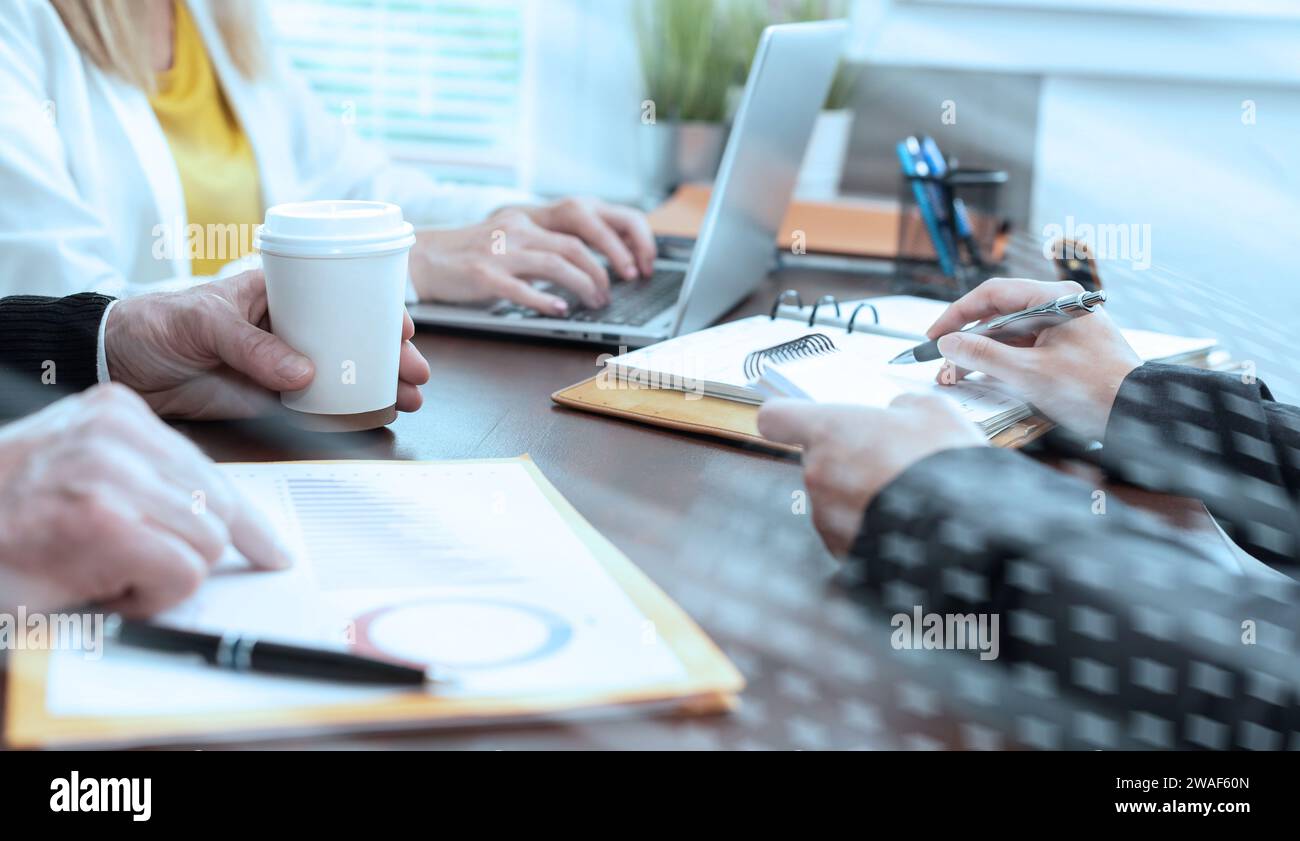 Group of three people working together. teamwork concept; light effect ...