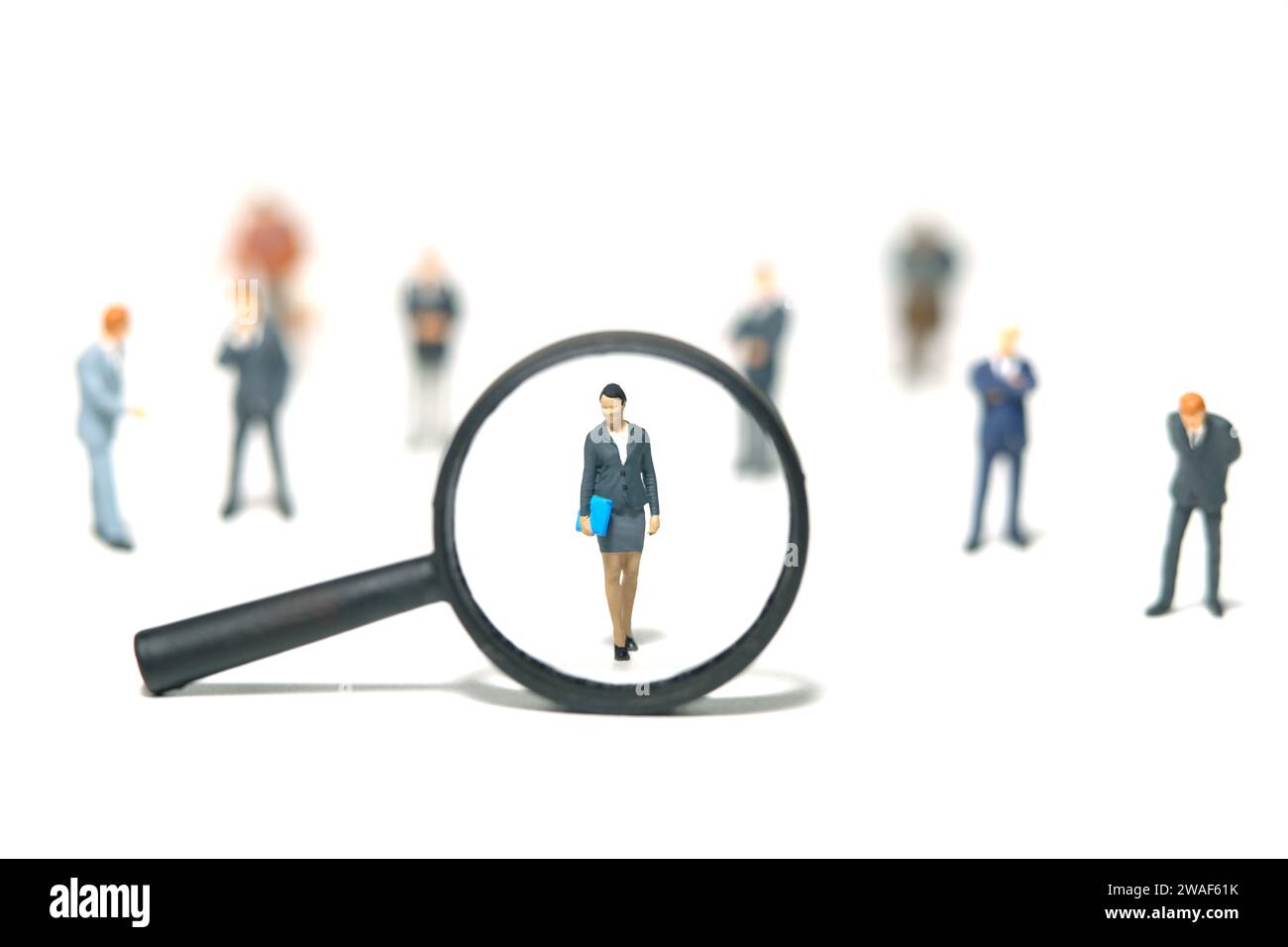 Miniature people toy figure photography. Women leader search. A ...