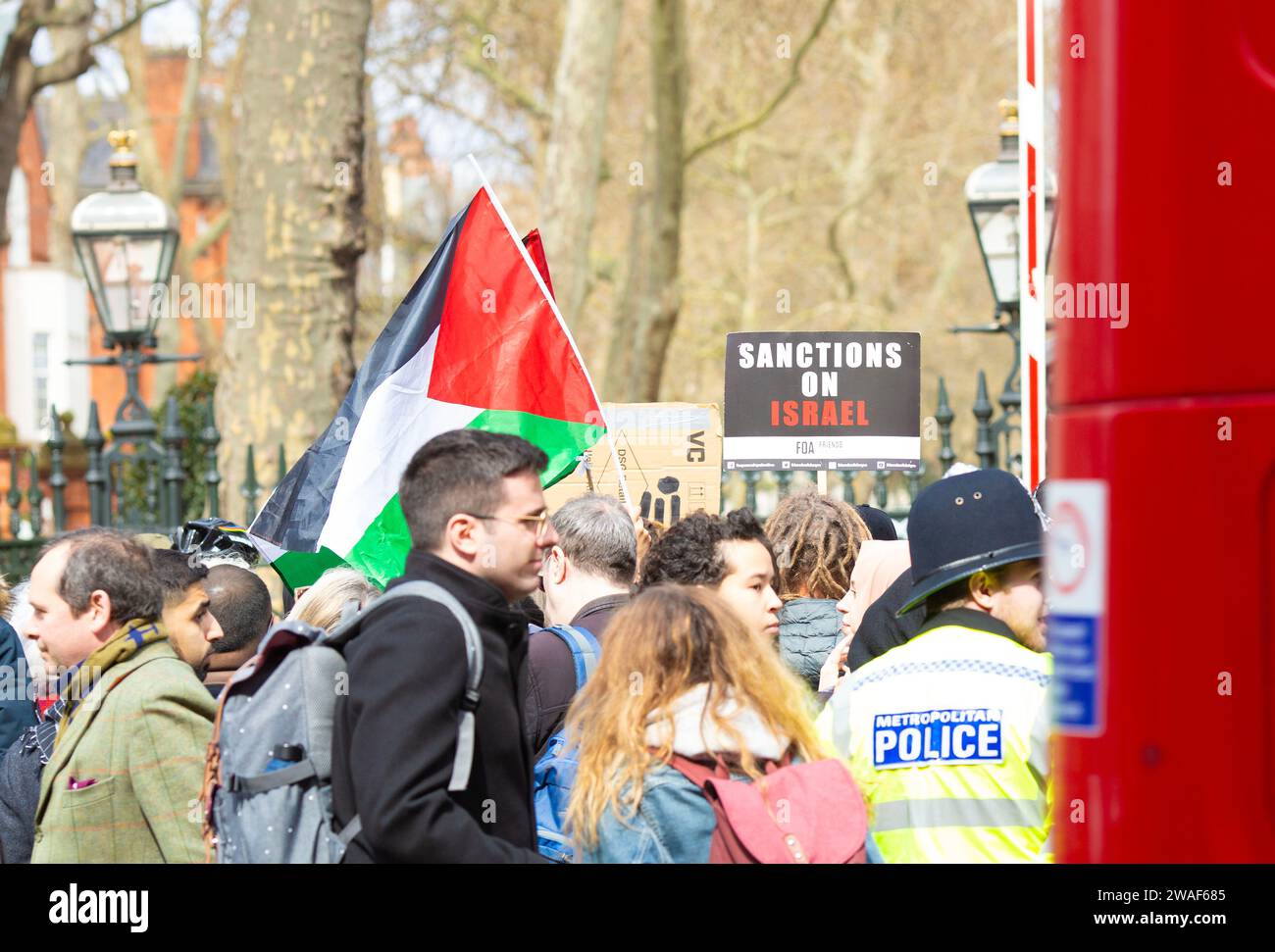 Pro-Palestinian protesters gather with flags and placards during a ...