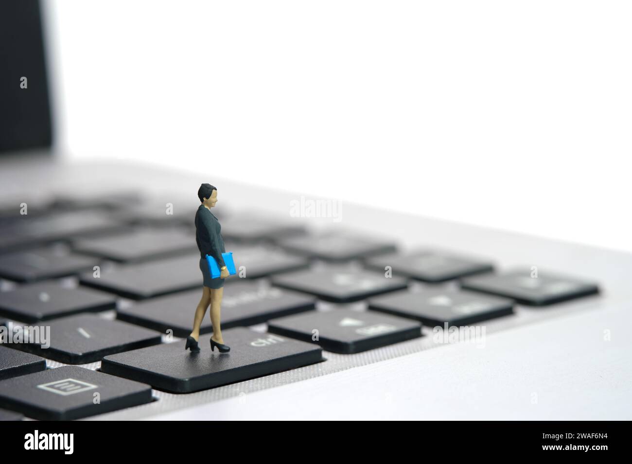 Miniature people toy figure photography. A businesswoman standing above ...