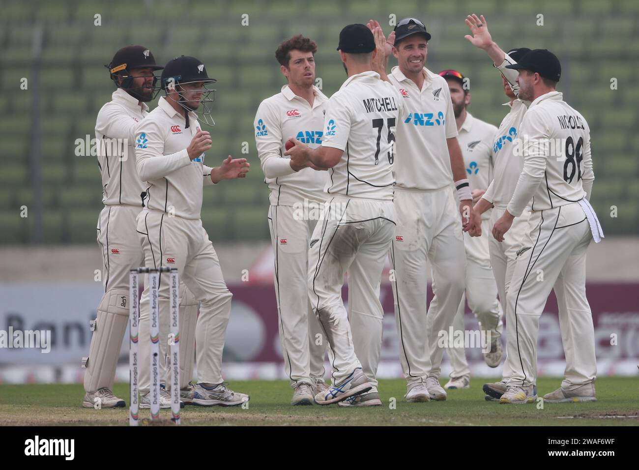 New Zealand spin bowler Mitchell Santner celebrates along teammates ...