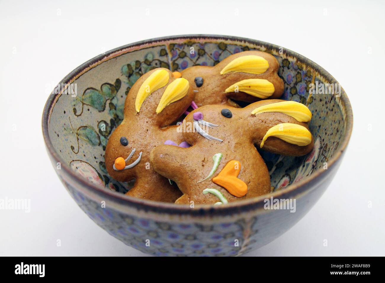 Easter gingerbread cookies in the shape of a bunny in a bowl. View from ...