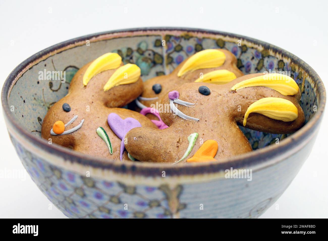 Easter gingerbread cookies in the shape of a bunny in a bowl. View from ...