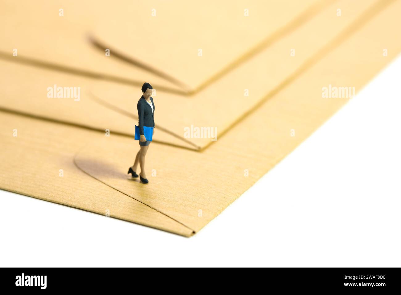 Miniature people toy figure photography. A businesswoman standing ...