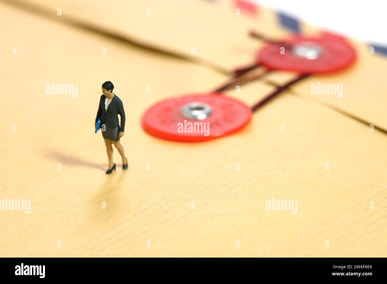 Miniature people toy figure photography. A businesswoman standing ...