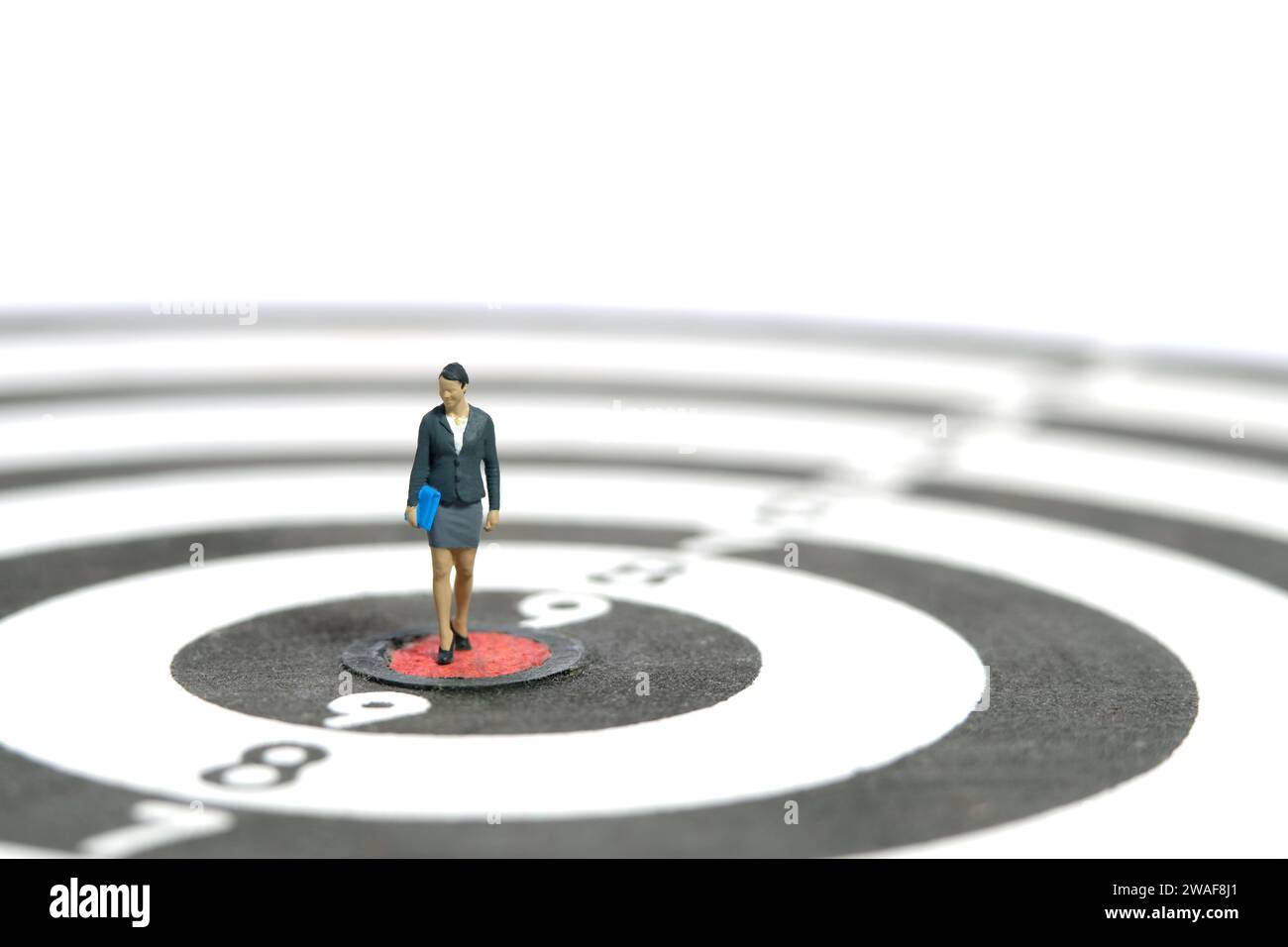 Miniature people toy figure photography. Career track concept. A ...