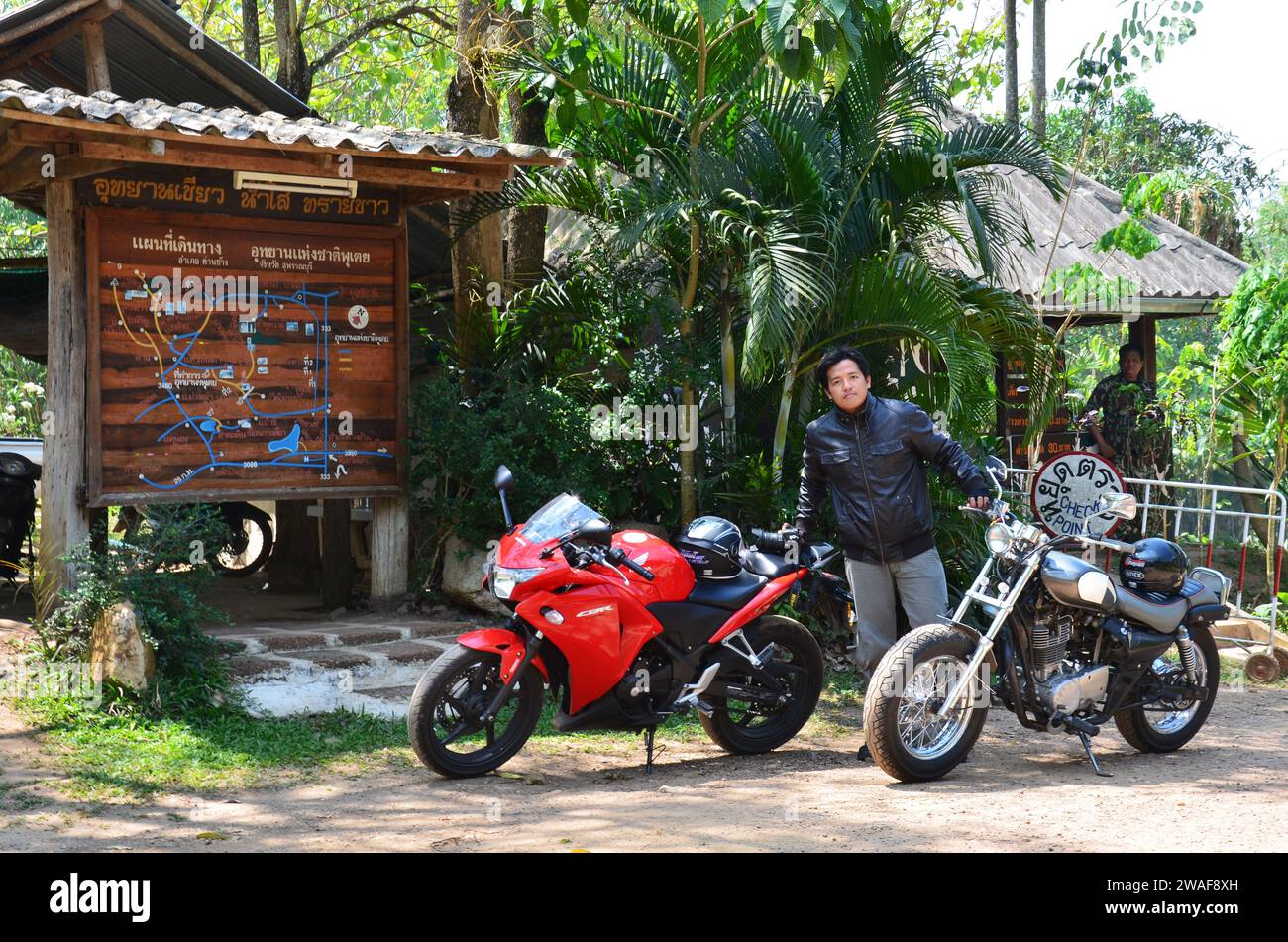 Thai man biker biking motorcycle travelers people riding motorbike travel visit Ban Taphoen Khi ...