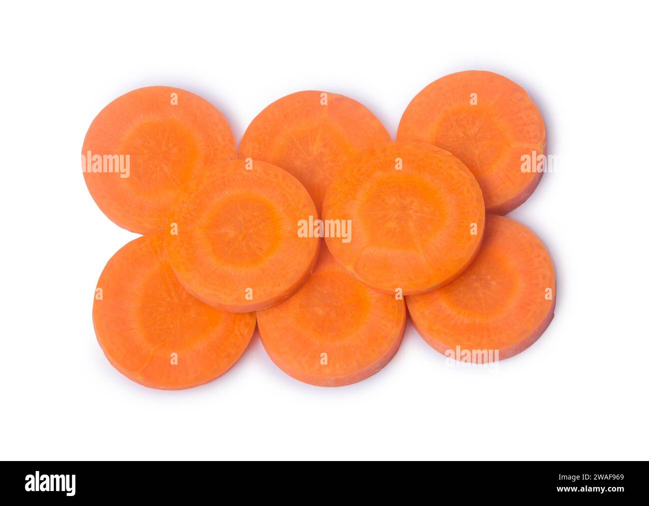 Fresh orange sliced carrots in stack are isolated on white background ...