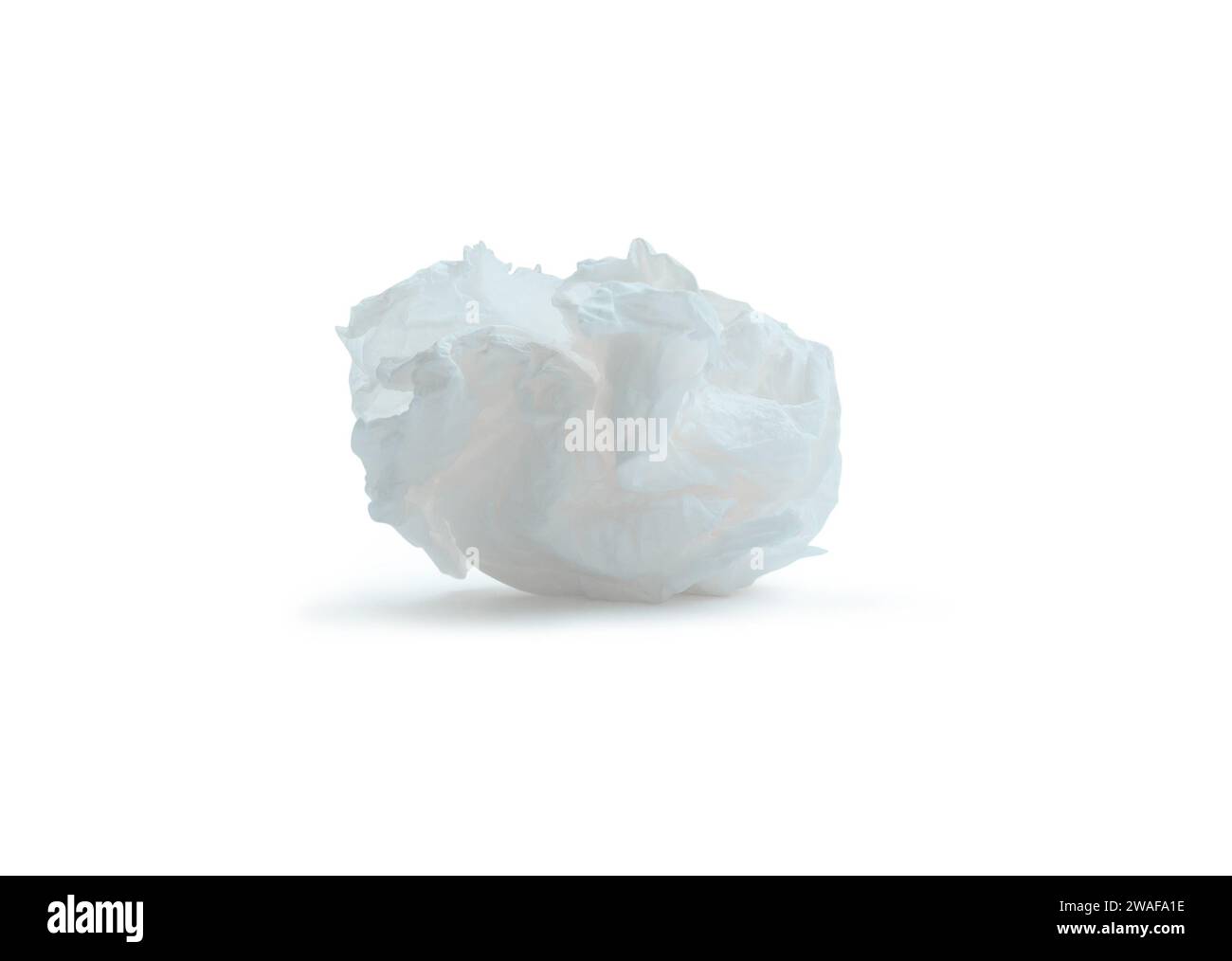 Single screwed or crumpled tissue paper or napkin after use is isolated ...