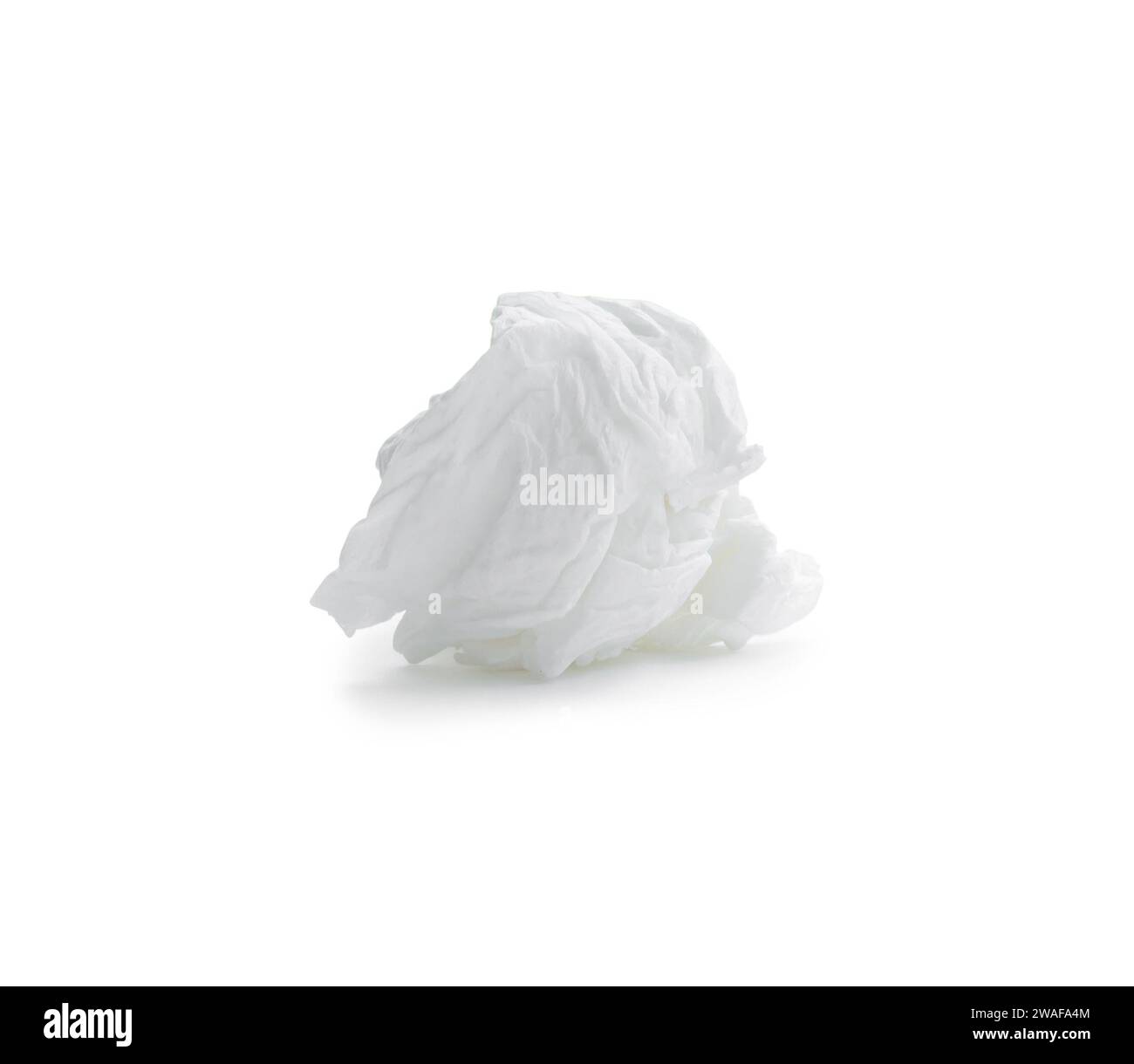 Single screwed or crumpled tissue paper or napkin after use is isolated ...