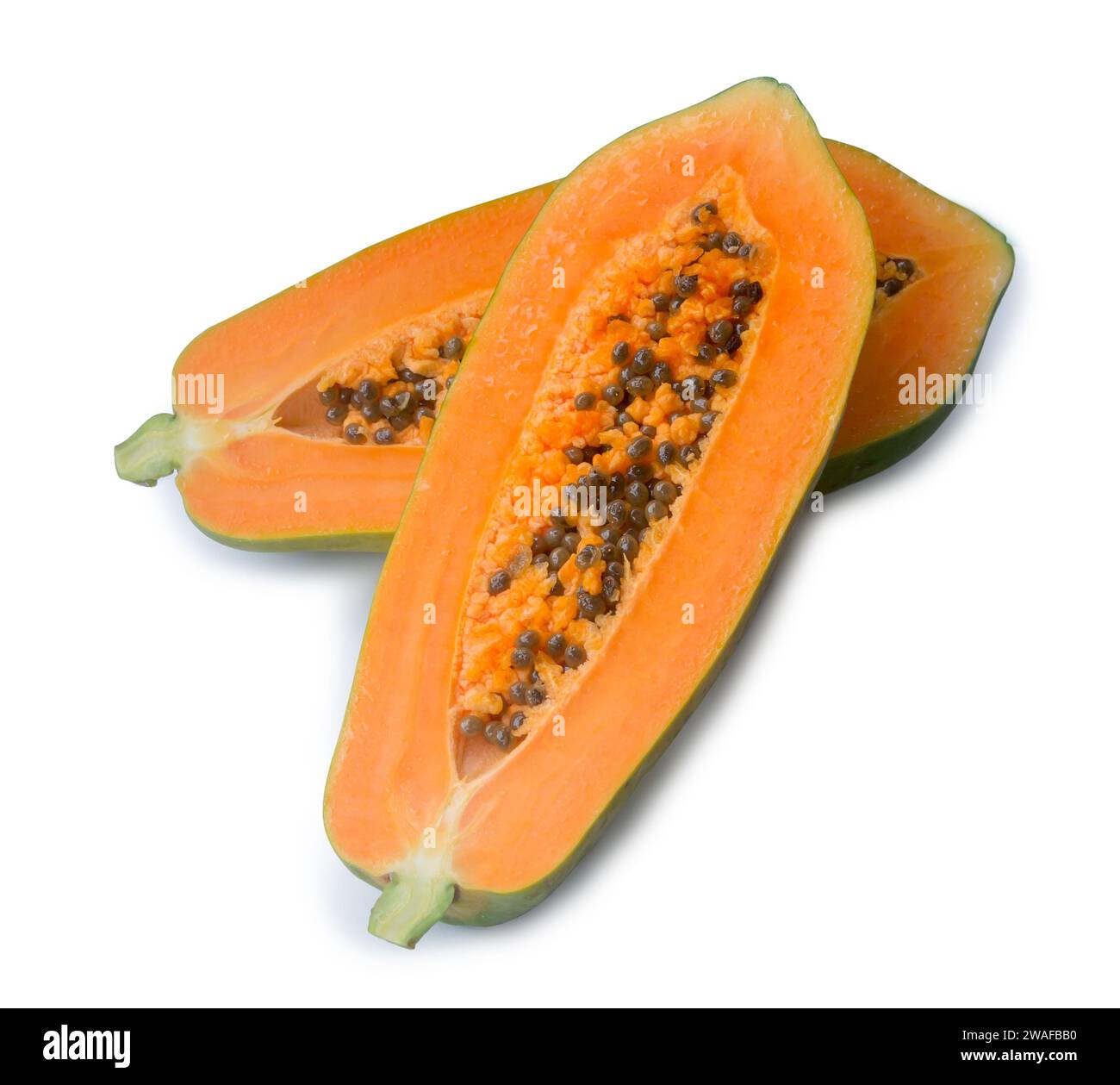 Two halves of fresh sweet papaya in stack are isolated on white ...