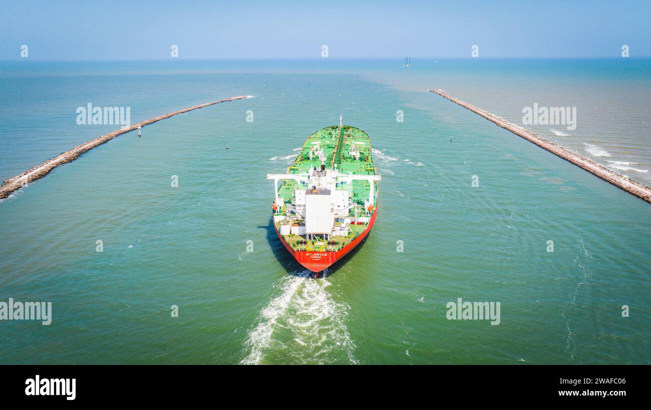 A large cargo ship sailing in the open waters of the Texas coast. Port ...