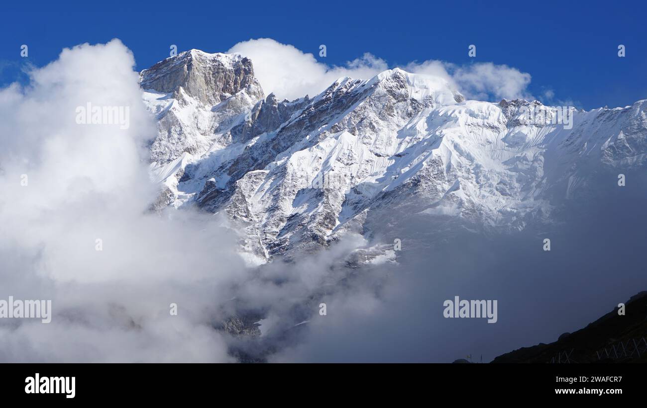 A majestic snow-capped mountain range standing tall and proud against a ...