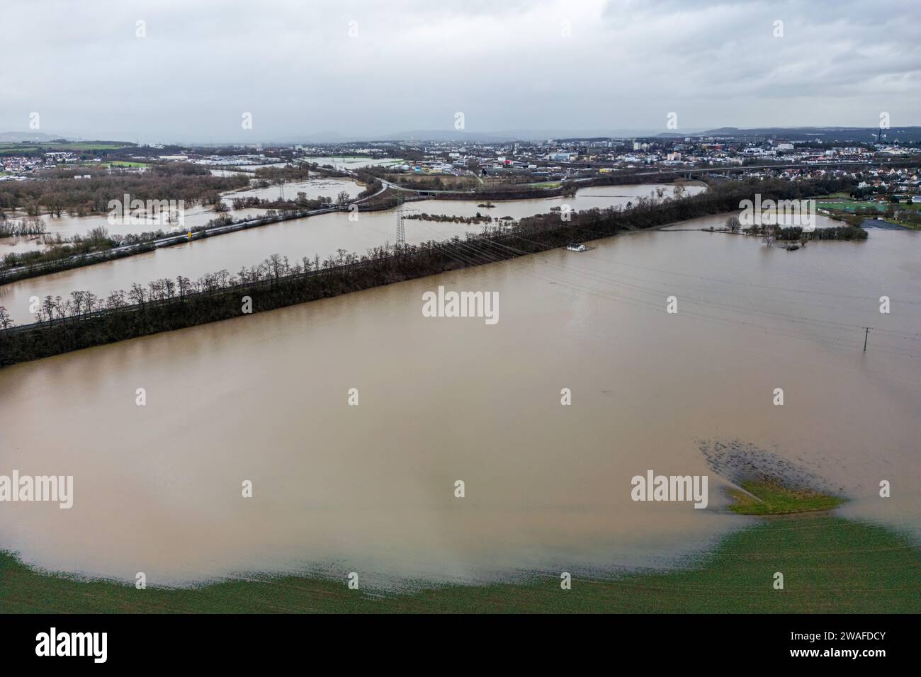04 January 2024, Hesse, Gießen: The Lahn has burst its banks (aerial ...