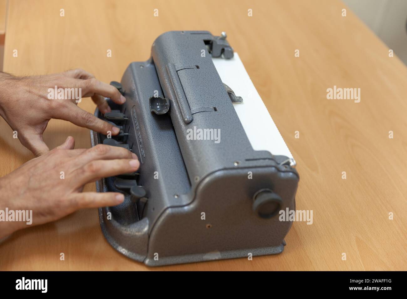 Blind or visually impaired person typing a Perkins Brailler Stock Photo ...