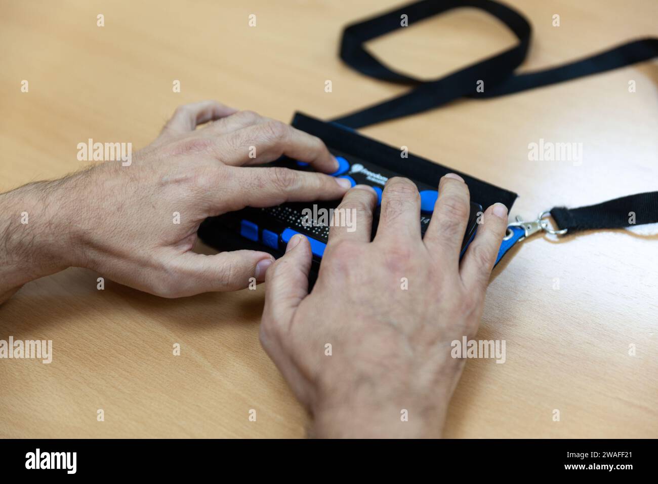 Blind or visually impaired person typing a smart Brailler Stock Photo ...