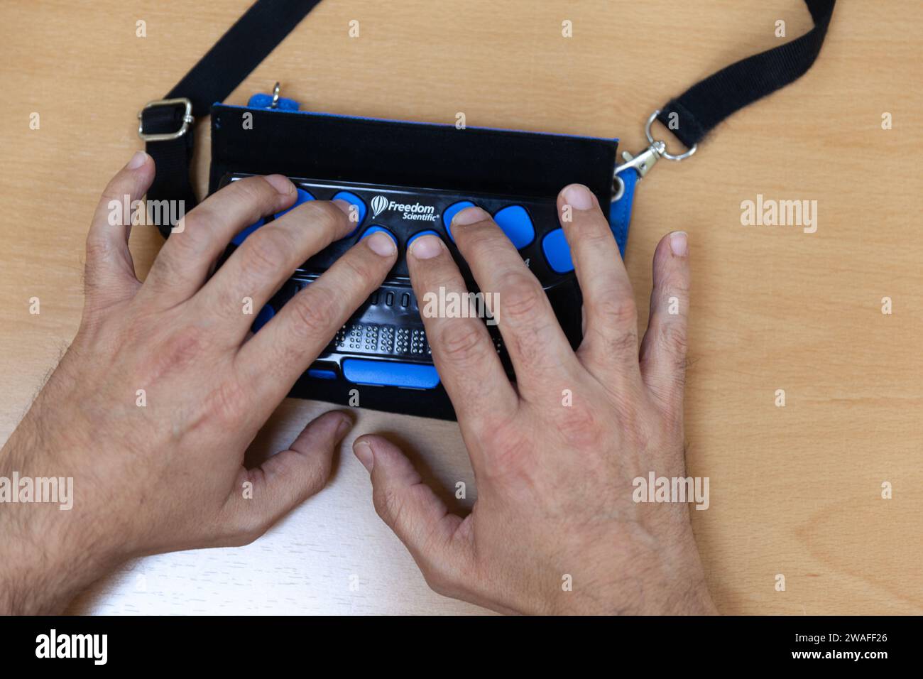 Blind or visually impaired person typing a smart Brailler Stock Photo ...