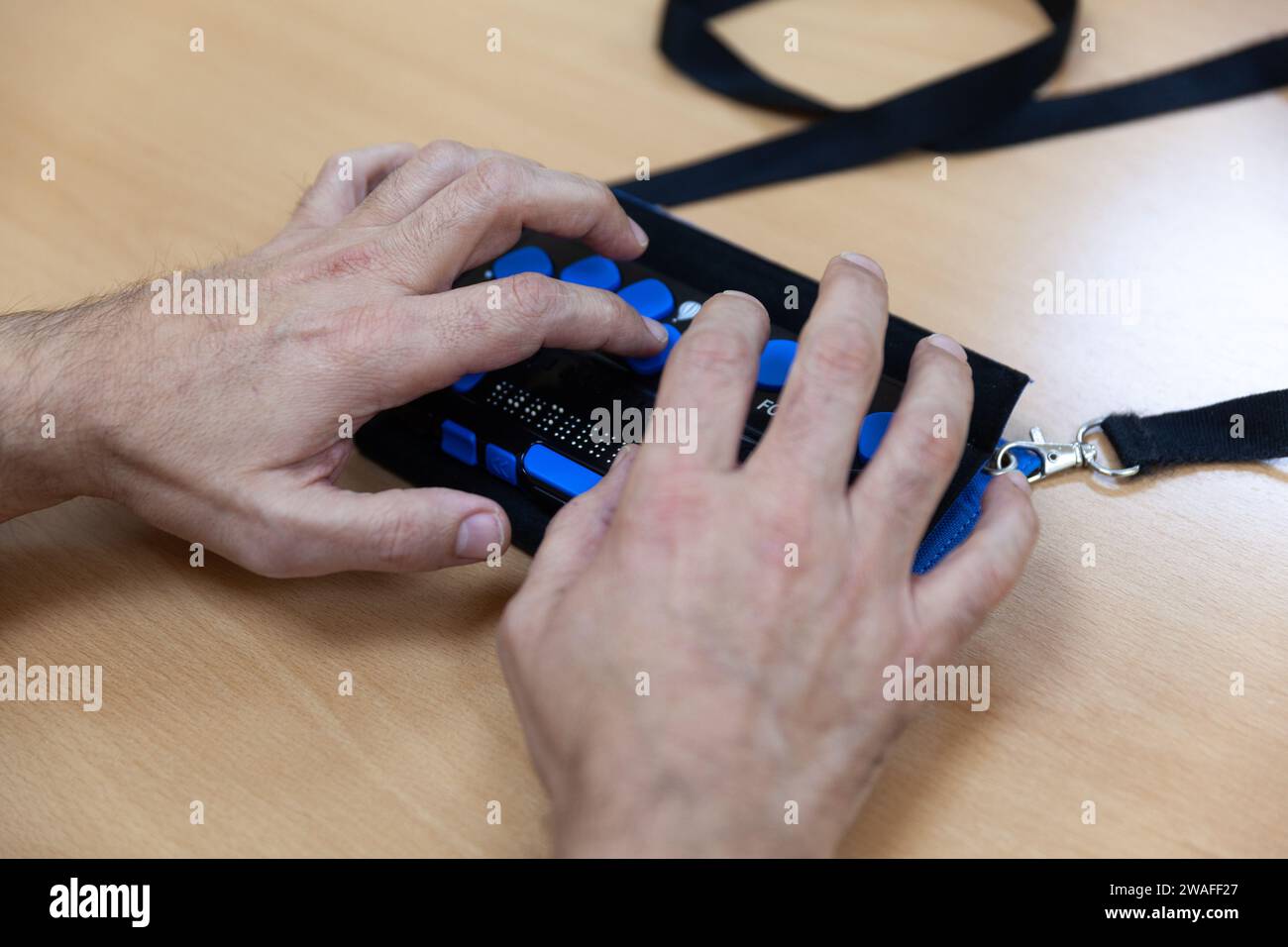 Blind or visually impaired person typing a smart Brailler Stock Photo ...