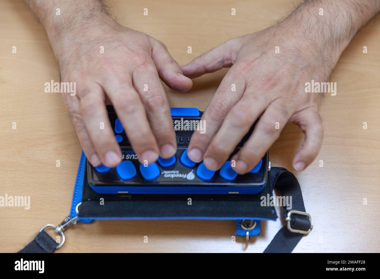 Blind or visually impaired person typing a smart Brailler Stock Photo ...