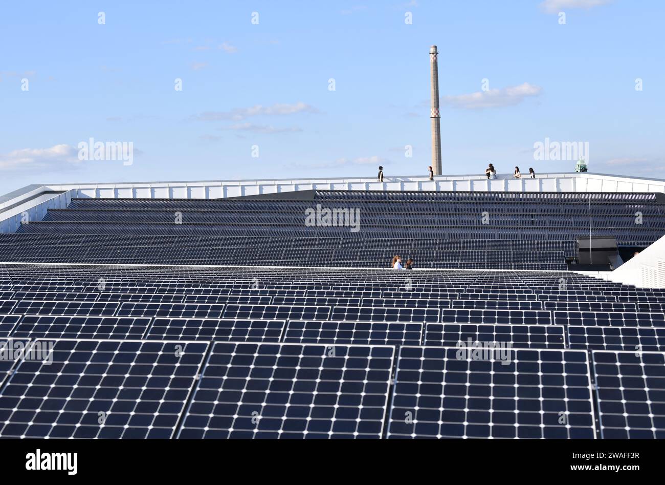 Berlin, Germany. 15th Sep, 2023. People walk among solar panels ...