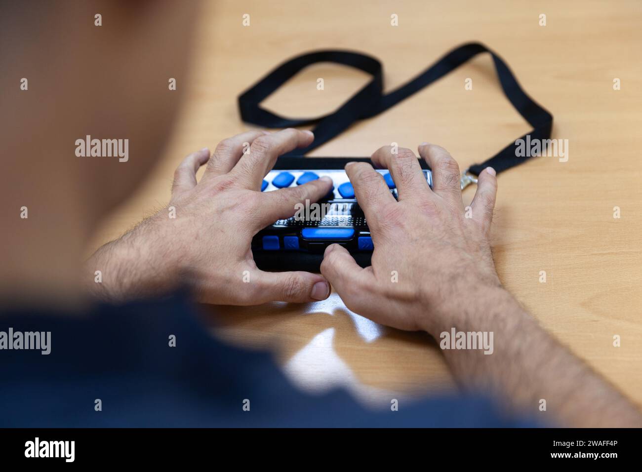 Blind or visually impaired person typing a smart Brailler Stock Photo ...