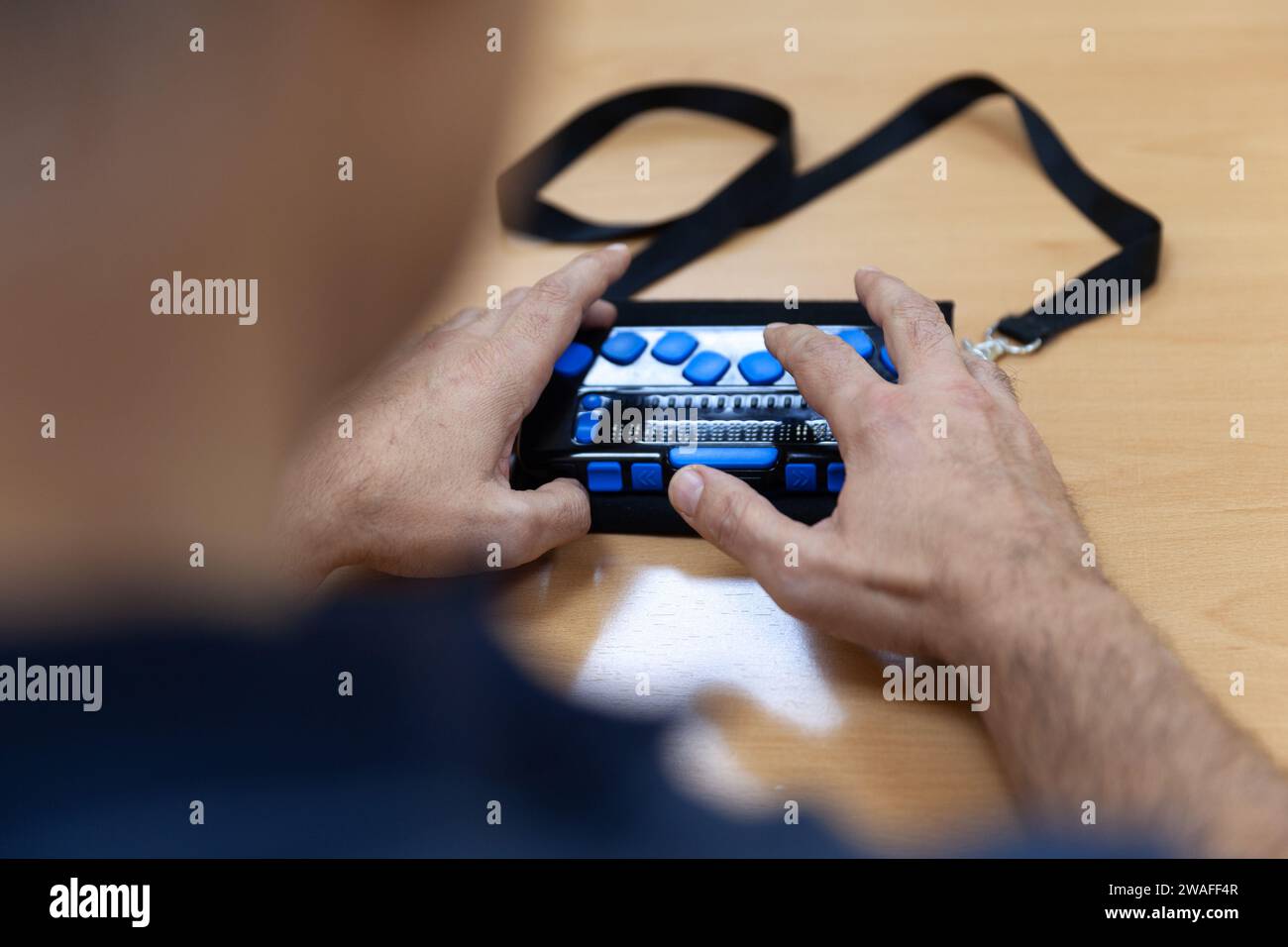 Blind or visually impaired person typing a smart Brailler Stock Photo ...